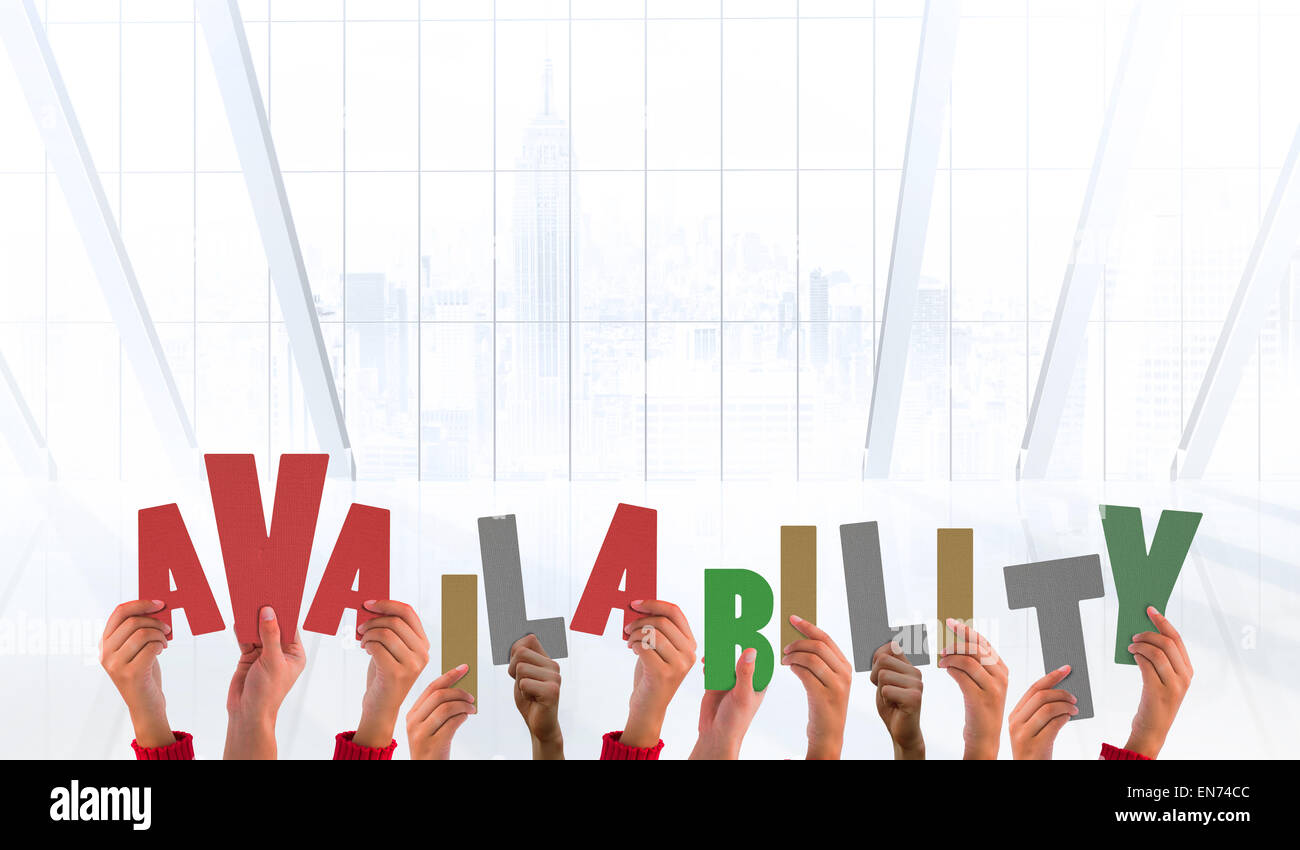 Composite image of hands holding up availability Stock Photo - Alamy