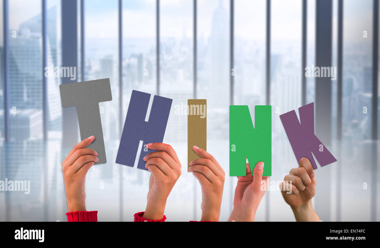 Composite image of hands holding up think Stock Photo - Alamy