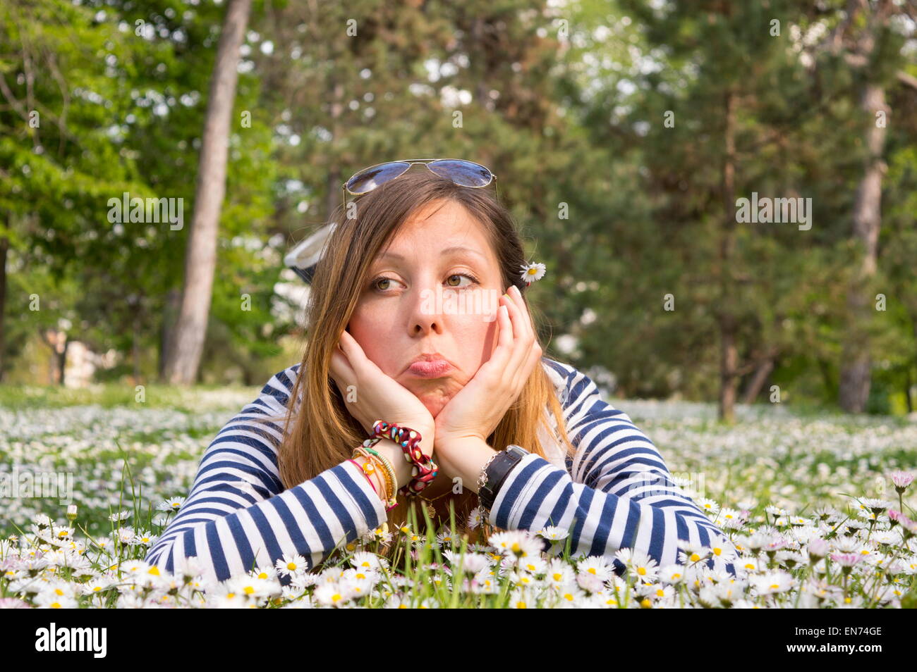 Teen girl lying in field hi-res stock photography and images - Alamy