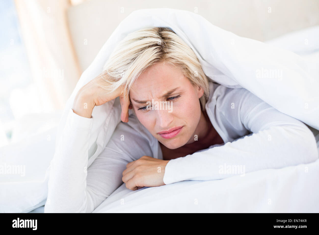 Sad young woman lying on hi-res stock photography and images - Alamy