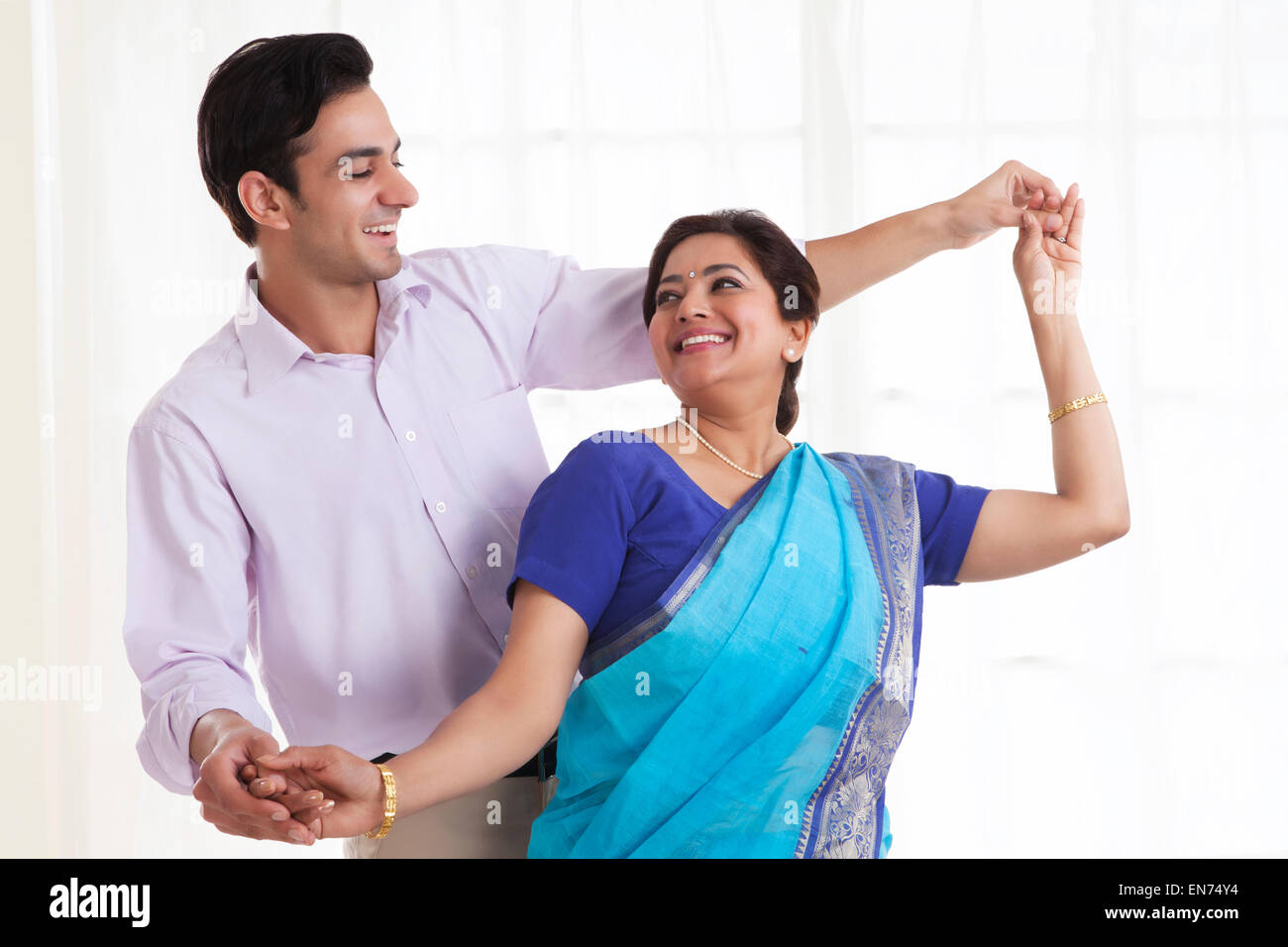 Son dancing with his mother Stock Photo - Alamy