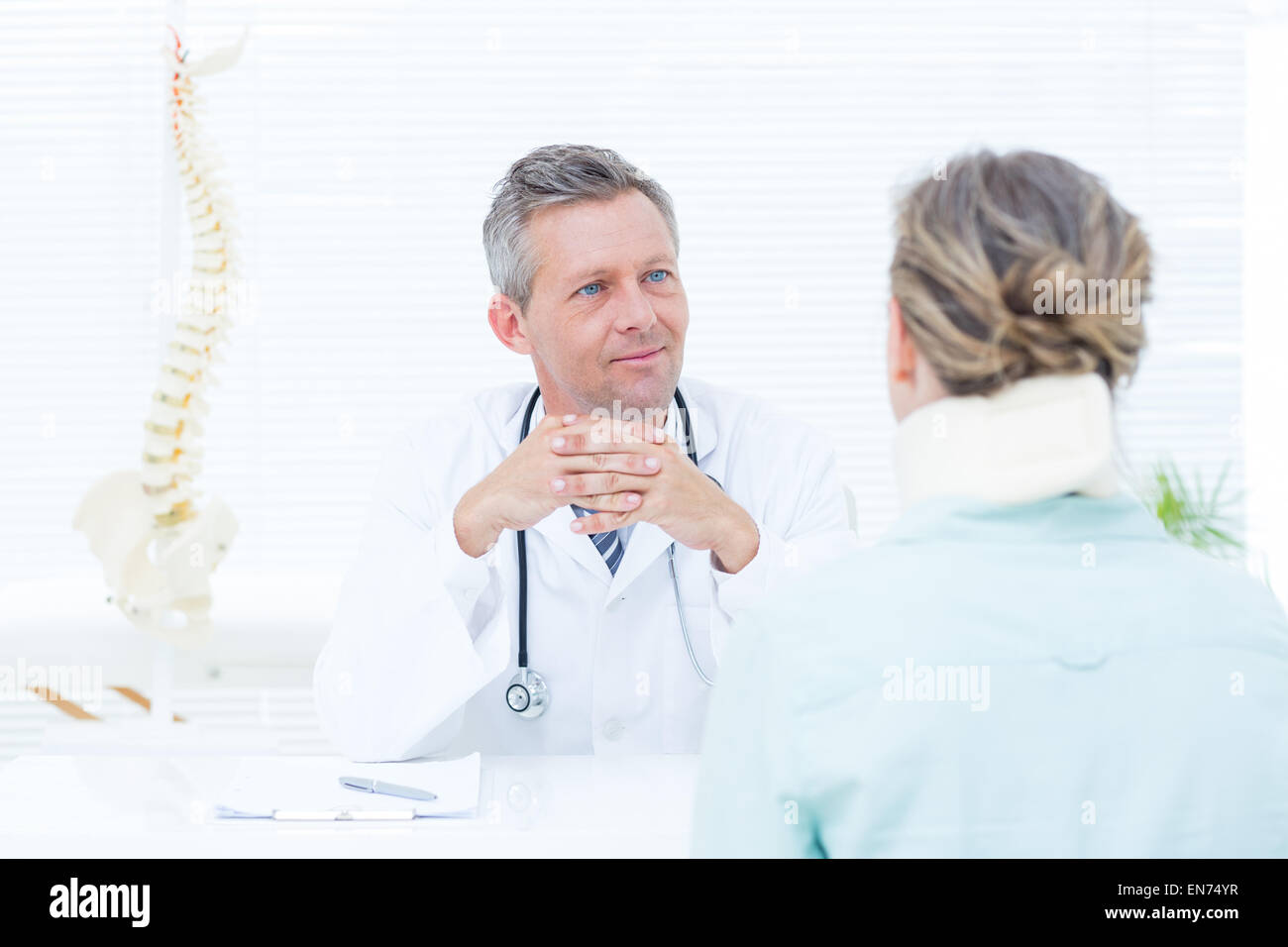 Doctor having conversation with his patient Stock Photo - Alamy