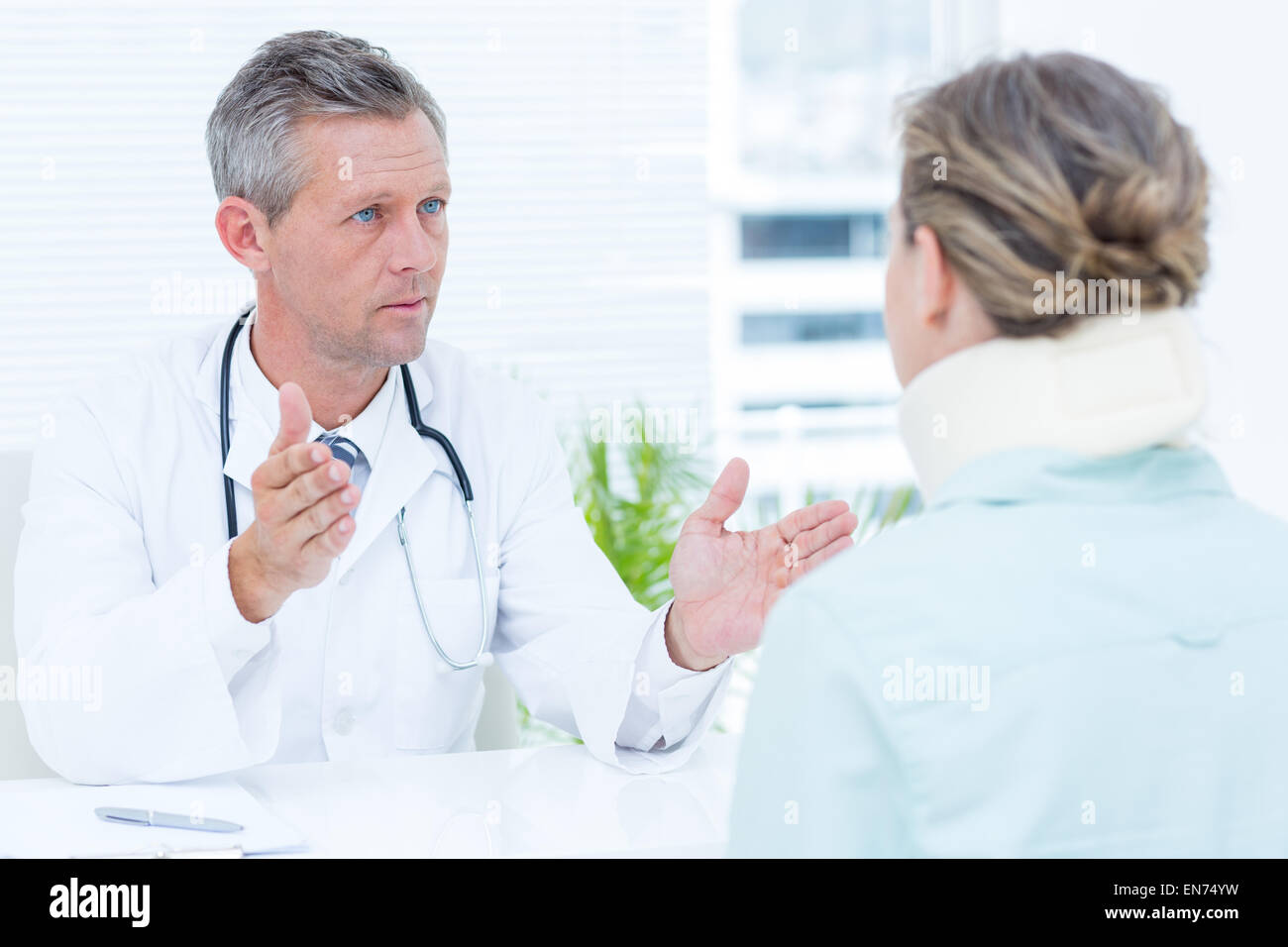 Doctor having conversation with his patient Stock Photo - Alamy