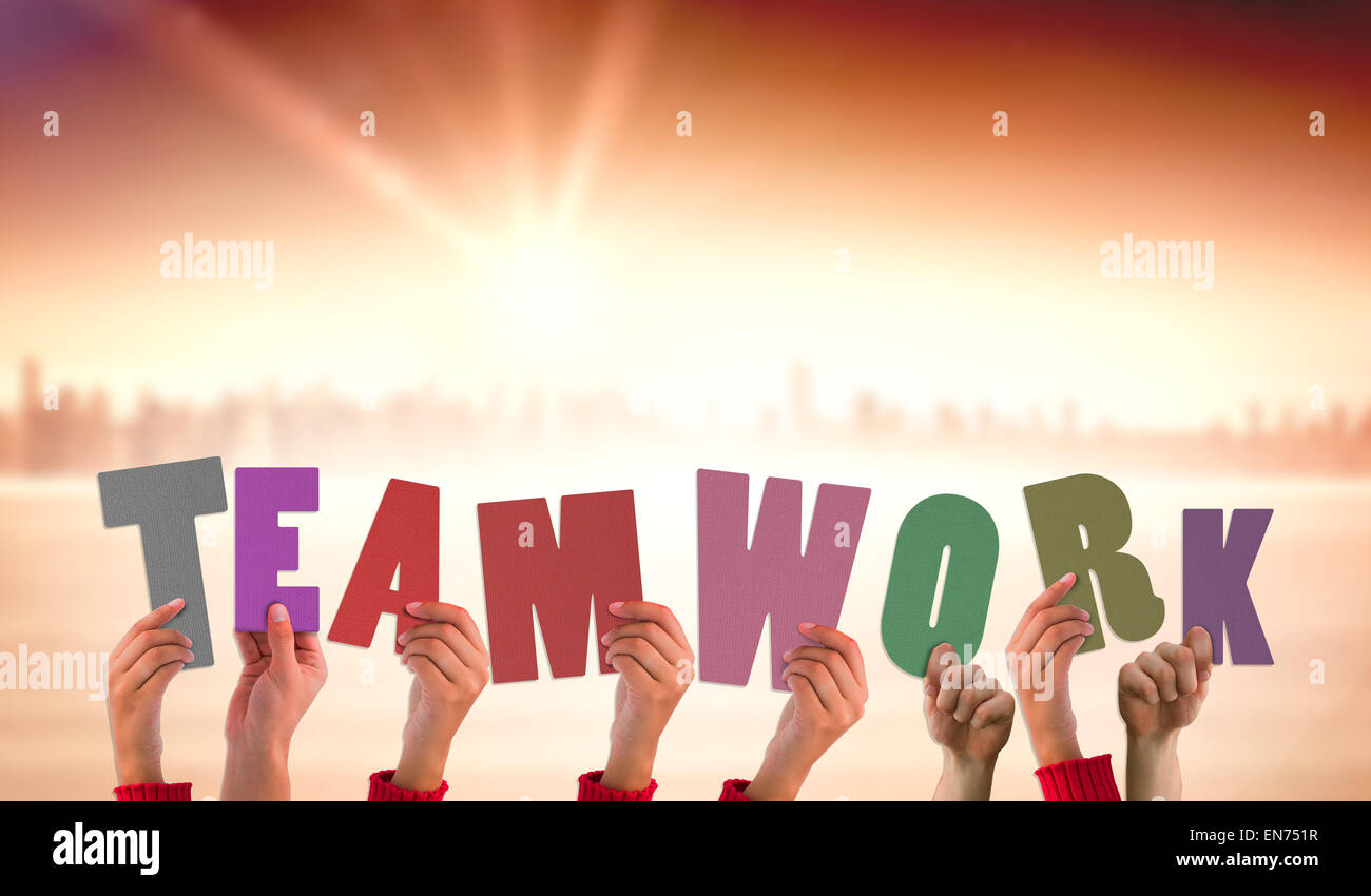 Composite image of hands showing teamwork Stock Photo - Alamy