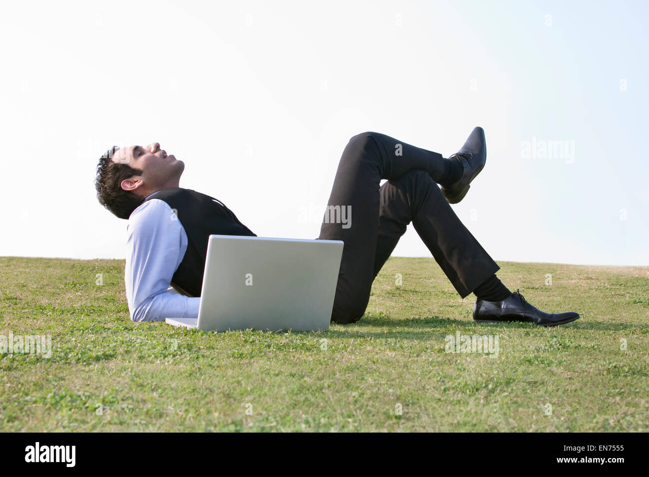 Businessman relaxing outdoors , INDIA , DELHI Stock Photo - Alamy