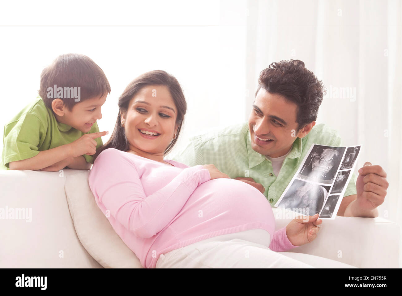 Family looking at ultrasound scans Stock Photo - Alamy