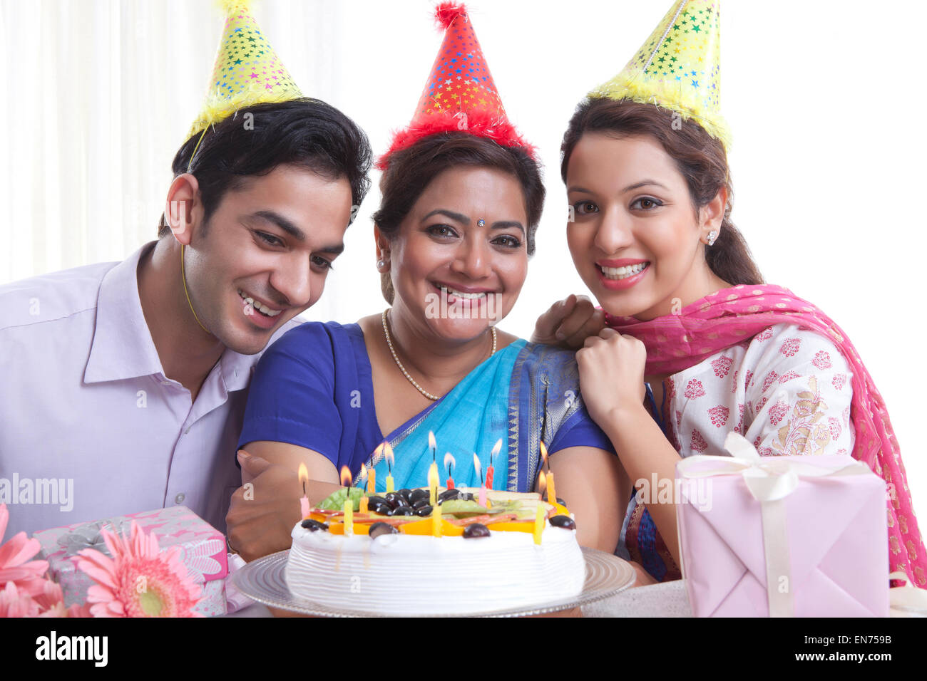 Portrait of family with a birthday cake Stock Photo - Alamy