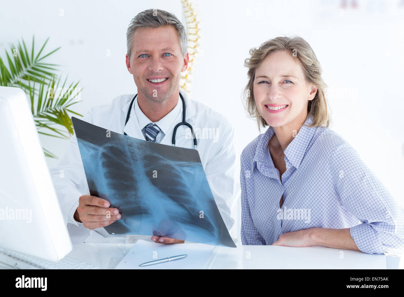 Female doctor talking camera clinic hi-res stock photography and images ...