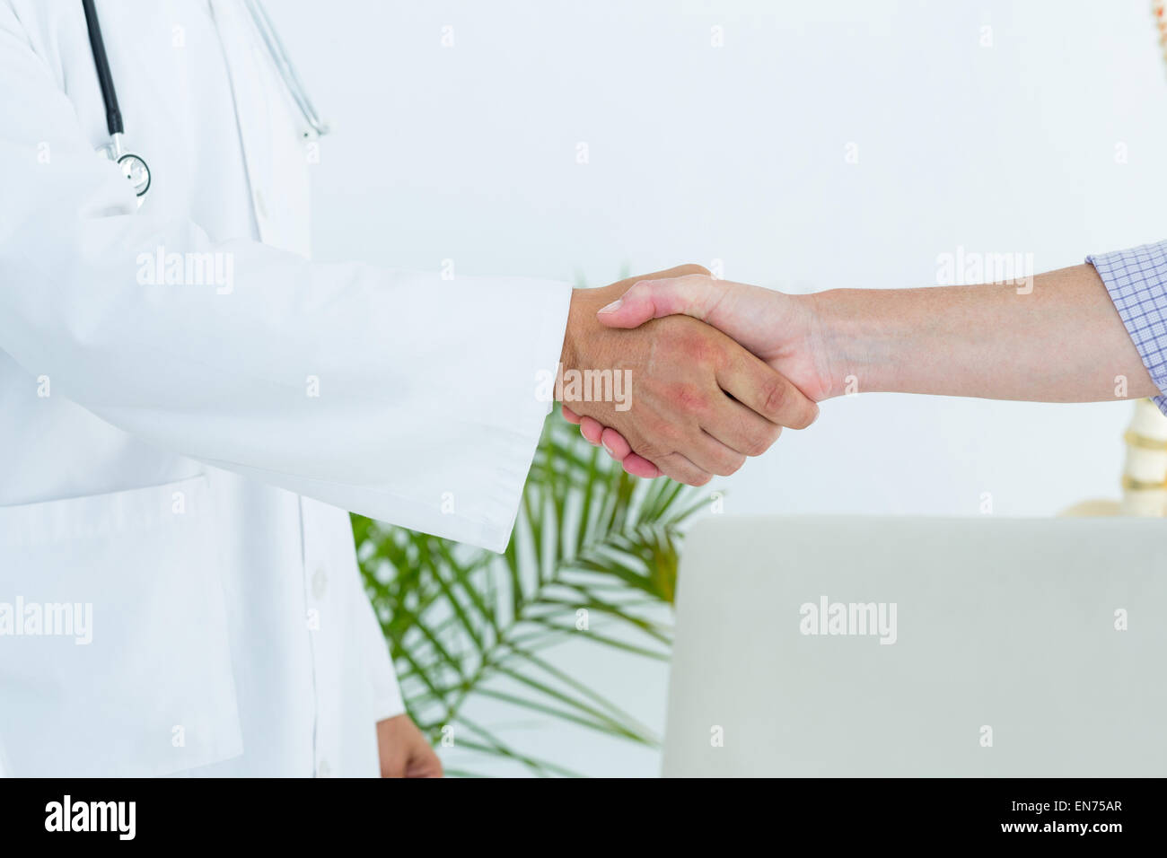 Doctor shaking hand of his patient Stock Photo - Alamy