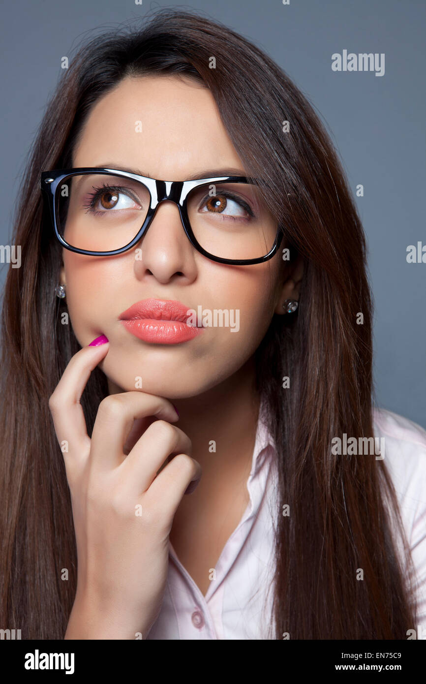 Female executive thinking Stock Photo - Alamy