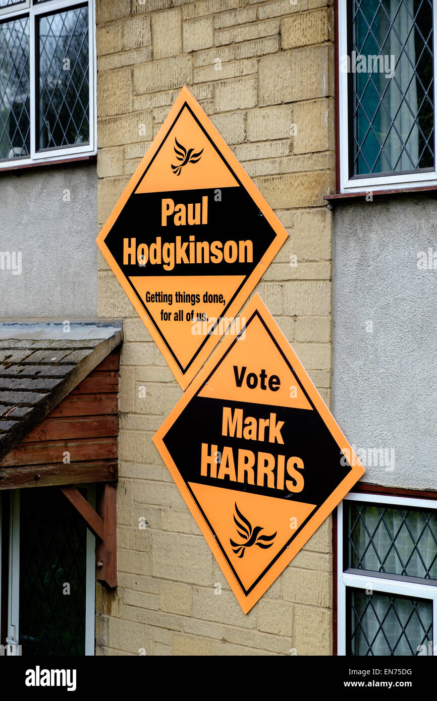 Two Liberal Democrat banners signs on the exterior wall of a house in ...