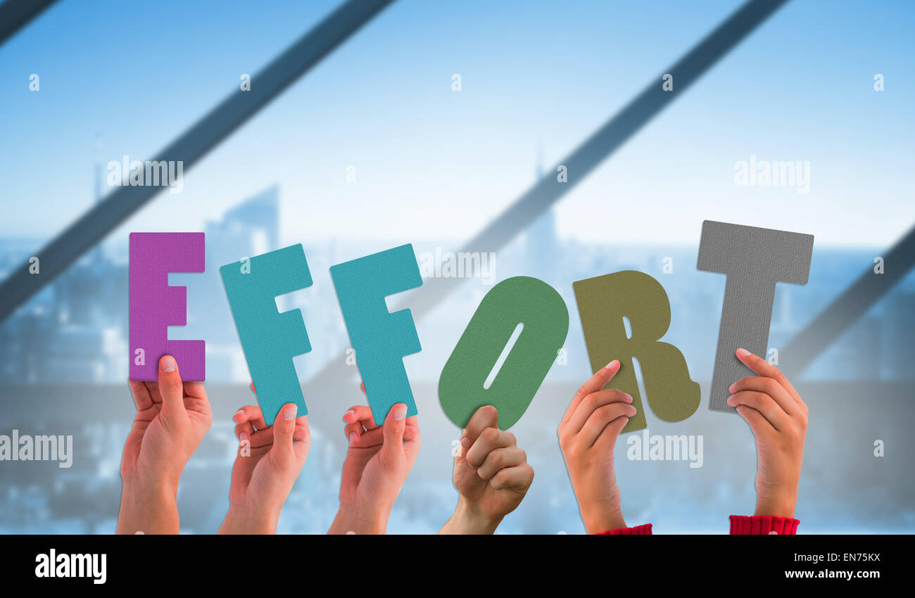 Composite image of hands holding up effort Stock Photo - Alamy