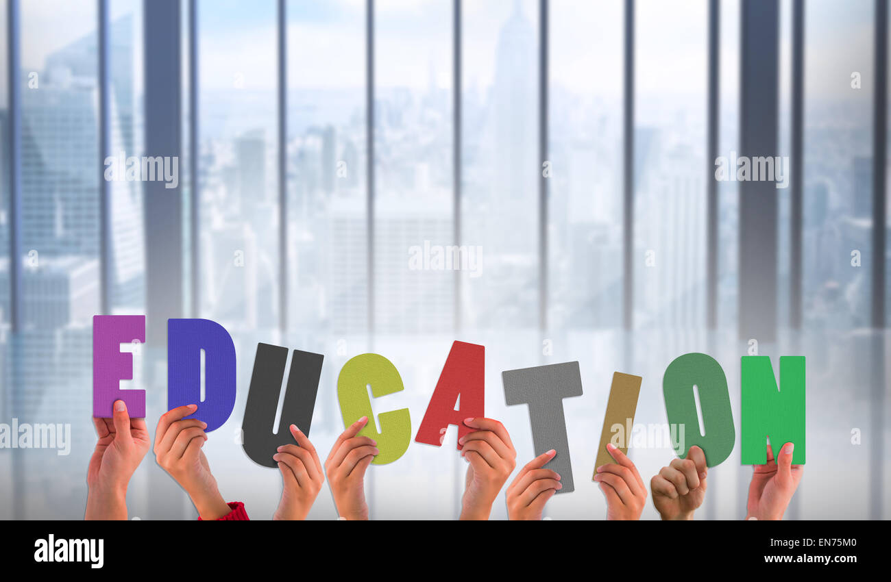 Composite image of hands showing education Stock Photo - Alamy