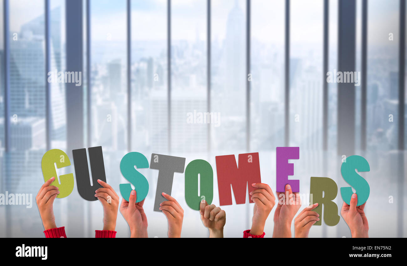 Composite image of hands showing customers Stock Photo - Alamy
