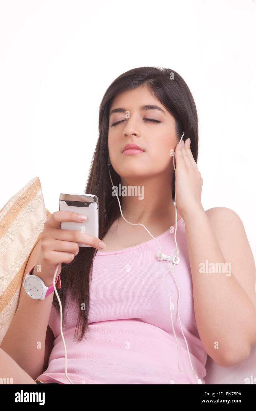 Young woman listening to music Stock Photo - Alamy