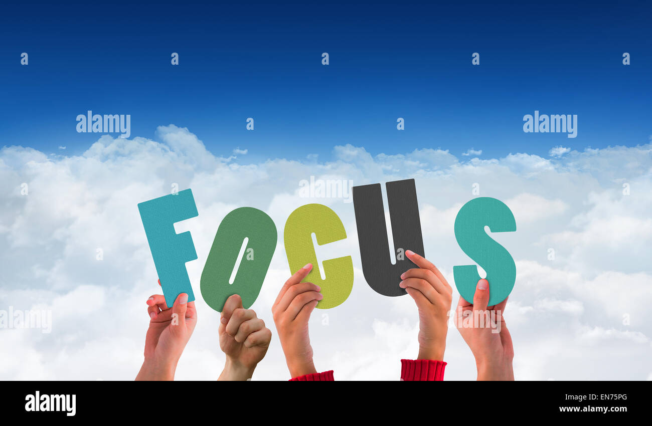 Composite image of hands showing focus Stock Photo - Alamy