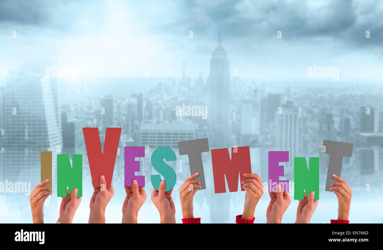 Composite image of hands showing investment Stock Photo - Alamy