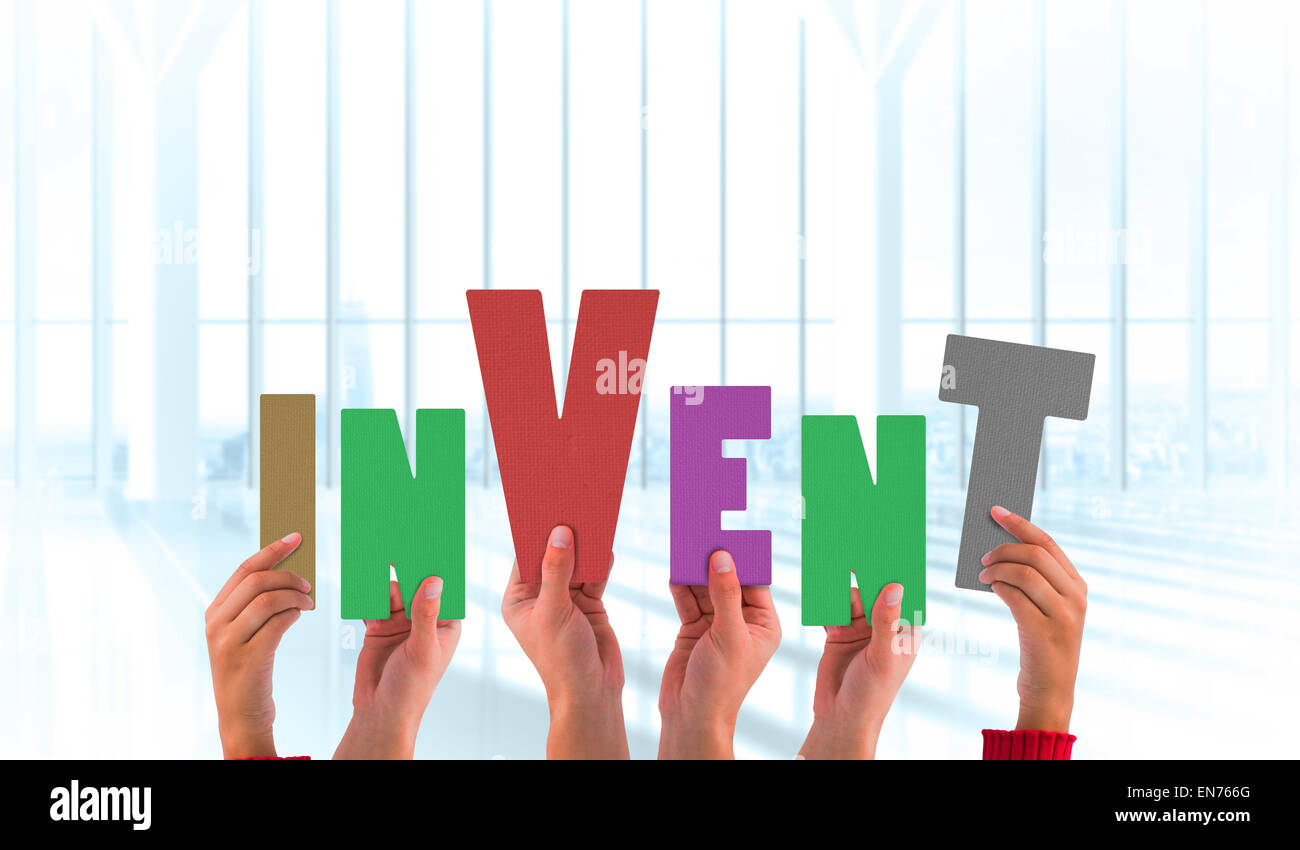 Composite image of hands holding up invent Stock Photo - Alamy