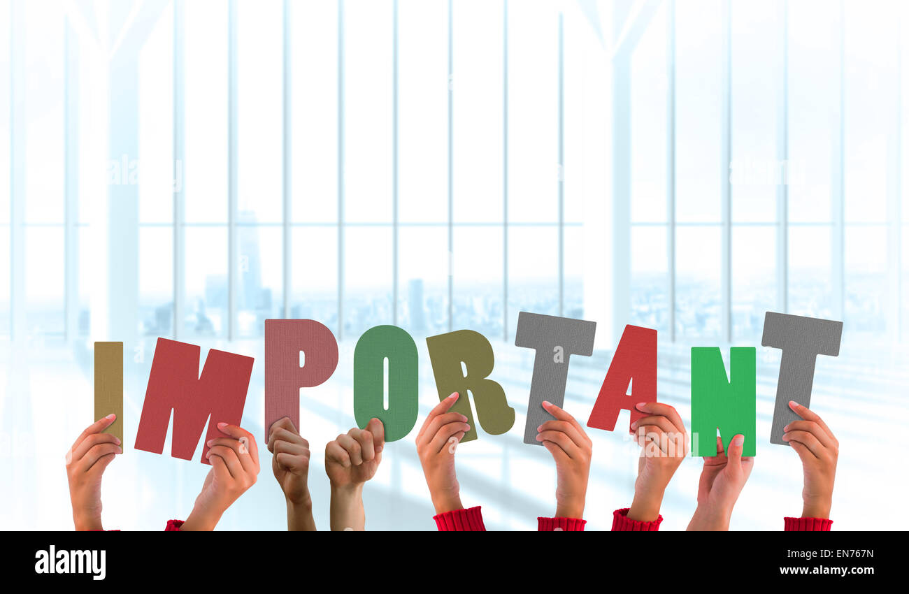 Composite image of hands holding up important Stock Photo - Alamy