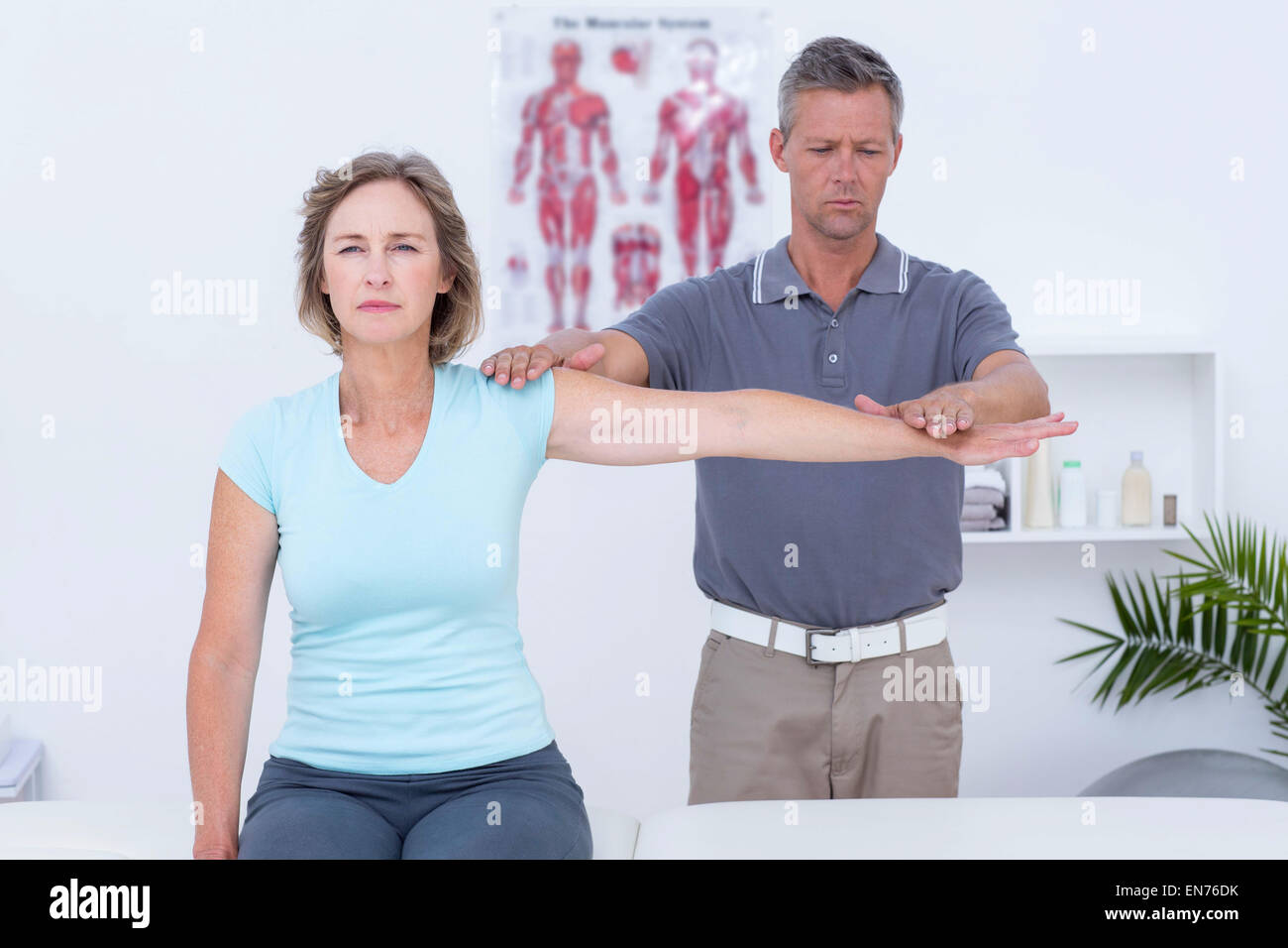 Doctor examining his patient arm Stock Photo - Alamy