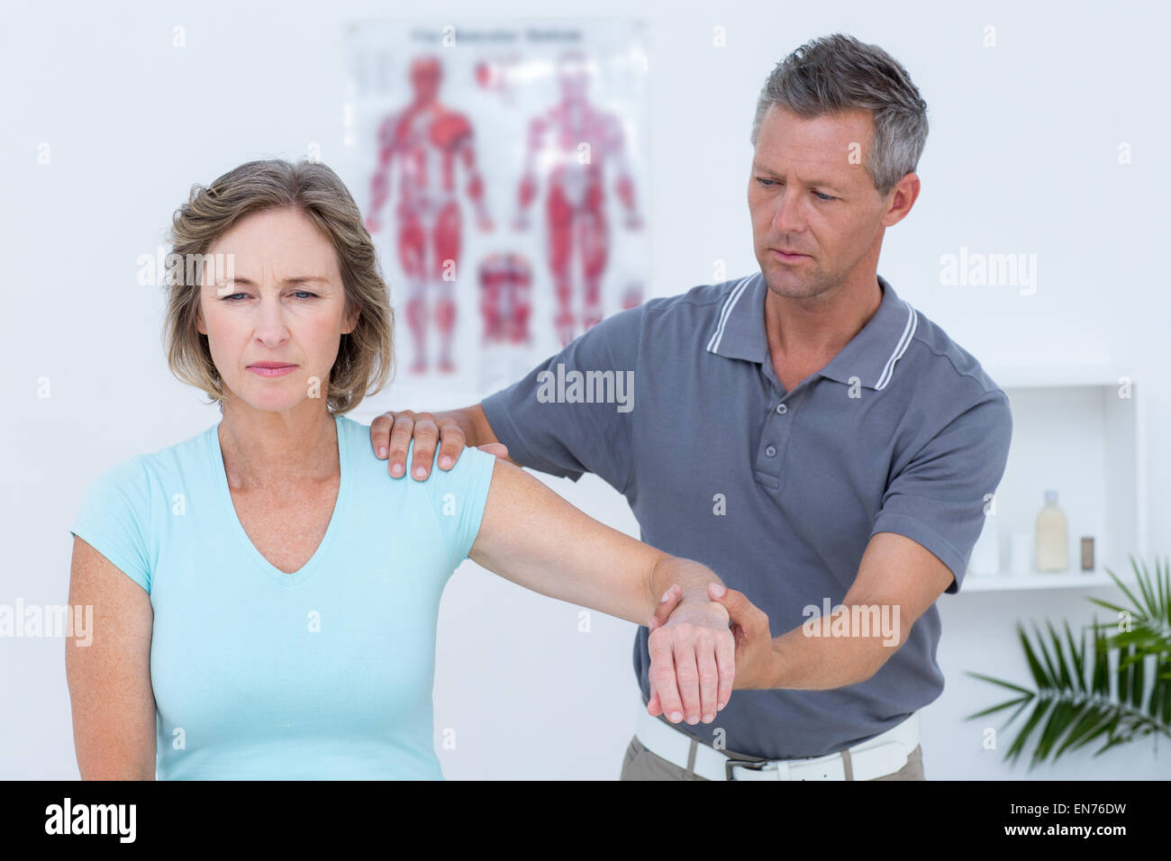 Doctor examining his patient arm Stock Photo - Alamy