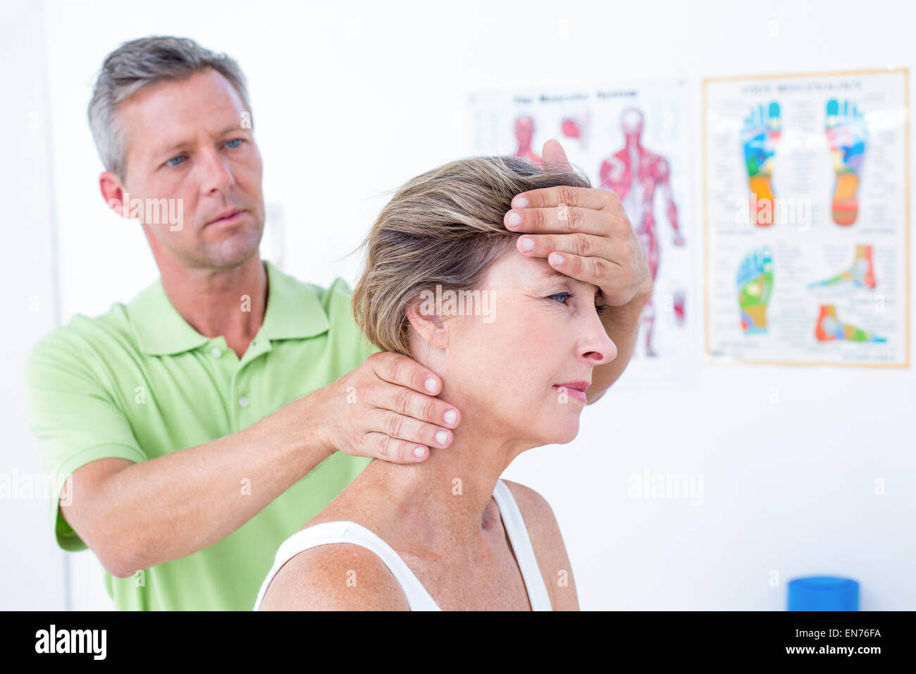 Doctor doing neck adjustment Stock Photo - Alamy