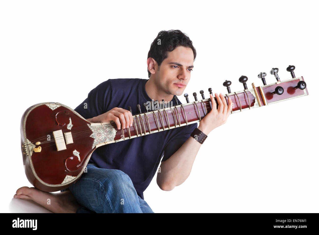 Young man playing the sitar Stock Photo - Alamy