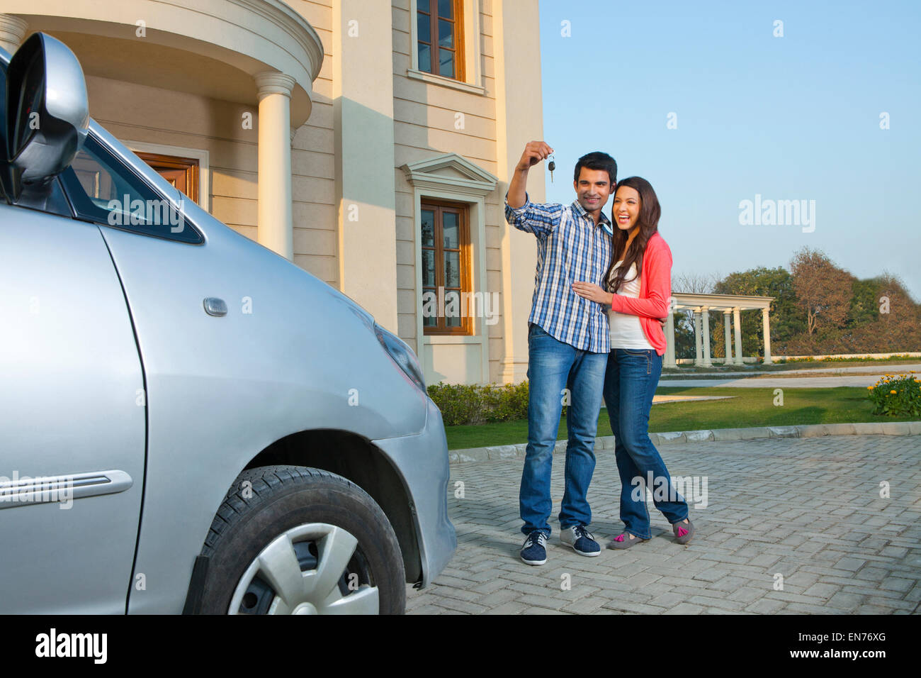 Young woman getting her house painted Stock Photo - Alamy