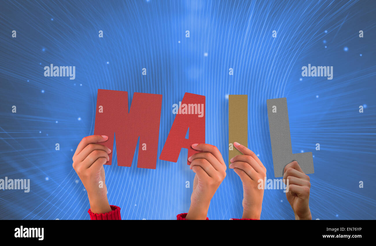Composite image of hands holding up mail Stock Photo - Alamy