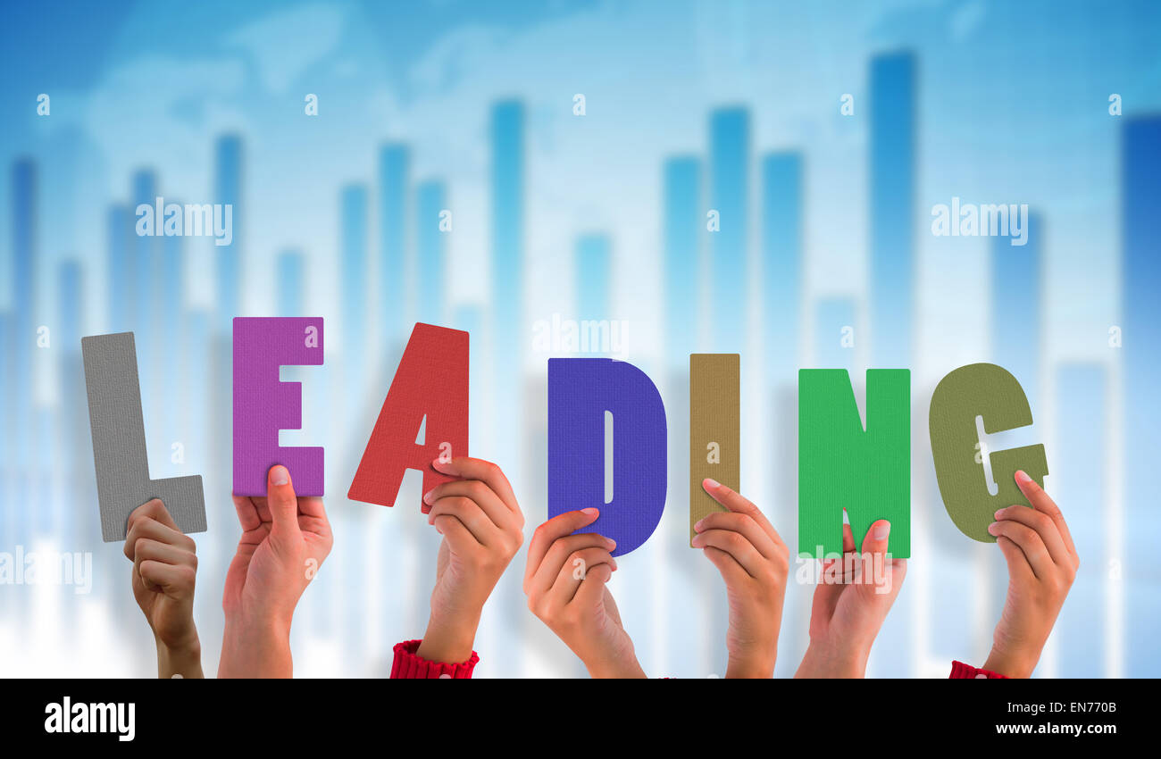 Composite image of hands holding up leading Stock Photo - Alamy