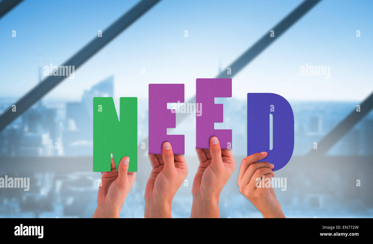 Composite image of hands holding up need Stock Photo - Alamy