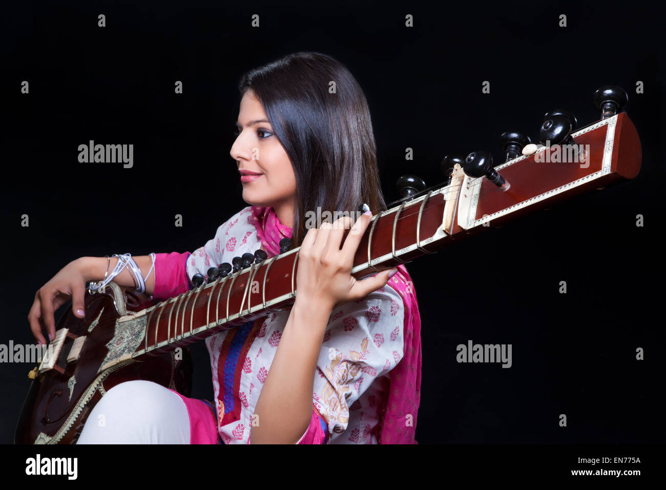 Young woman playing the sitar Stock Photo - Alamy