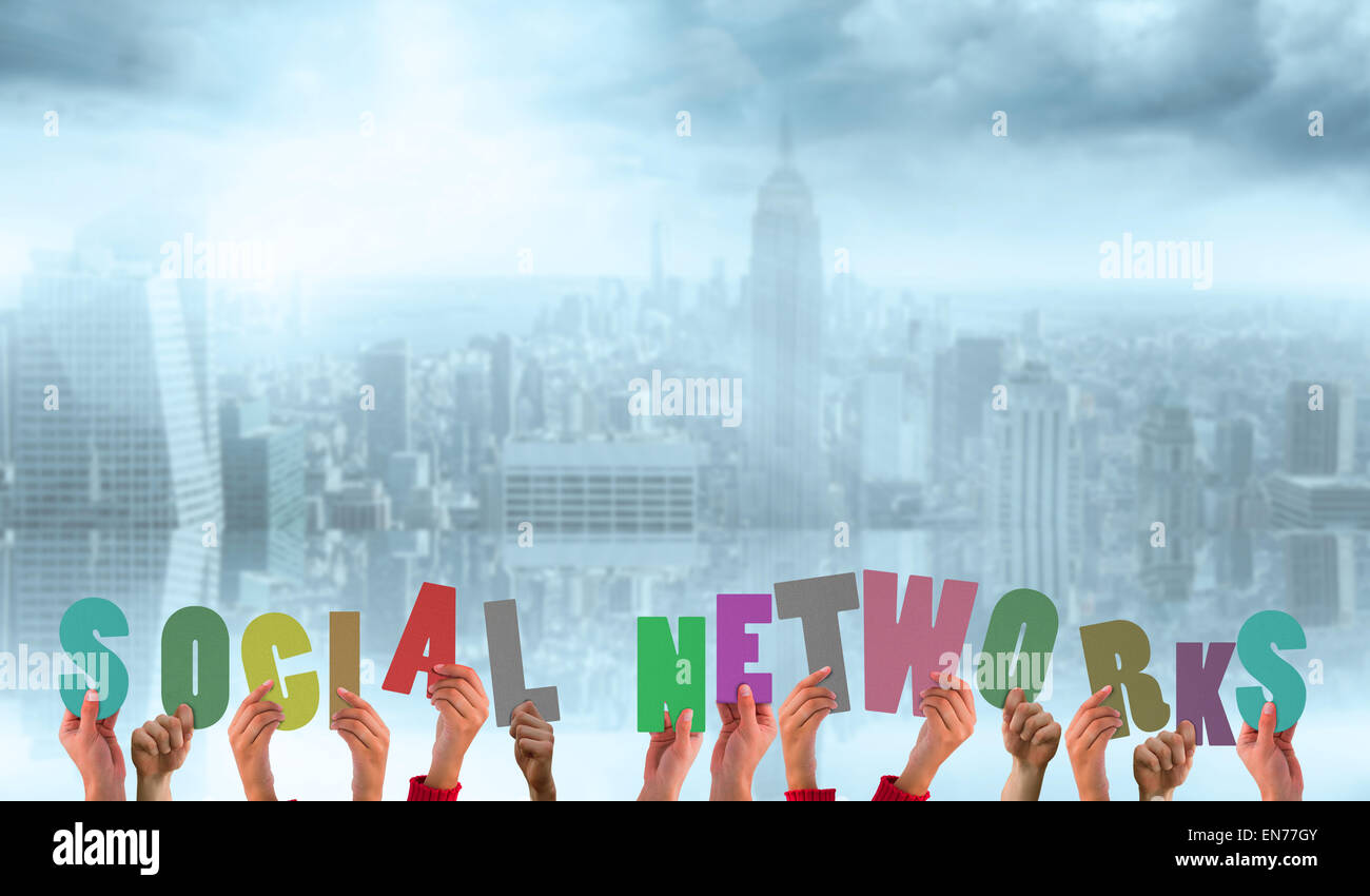 Composite image of hands showing social networks Stock Photo - Alamy