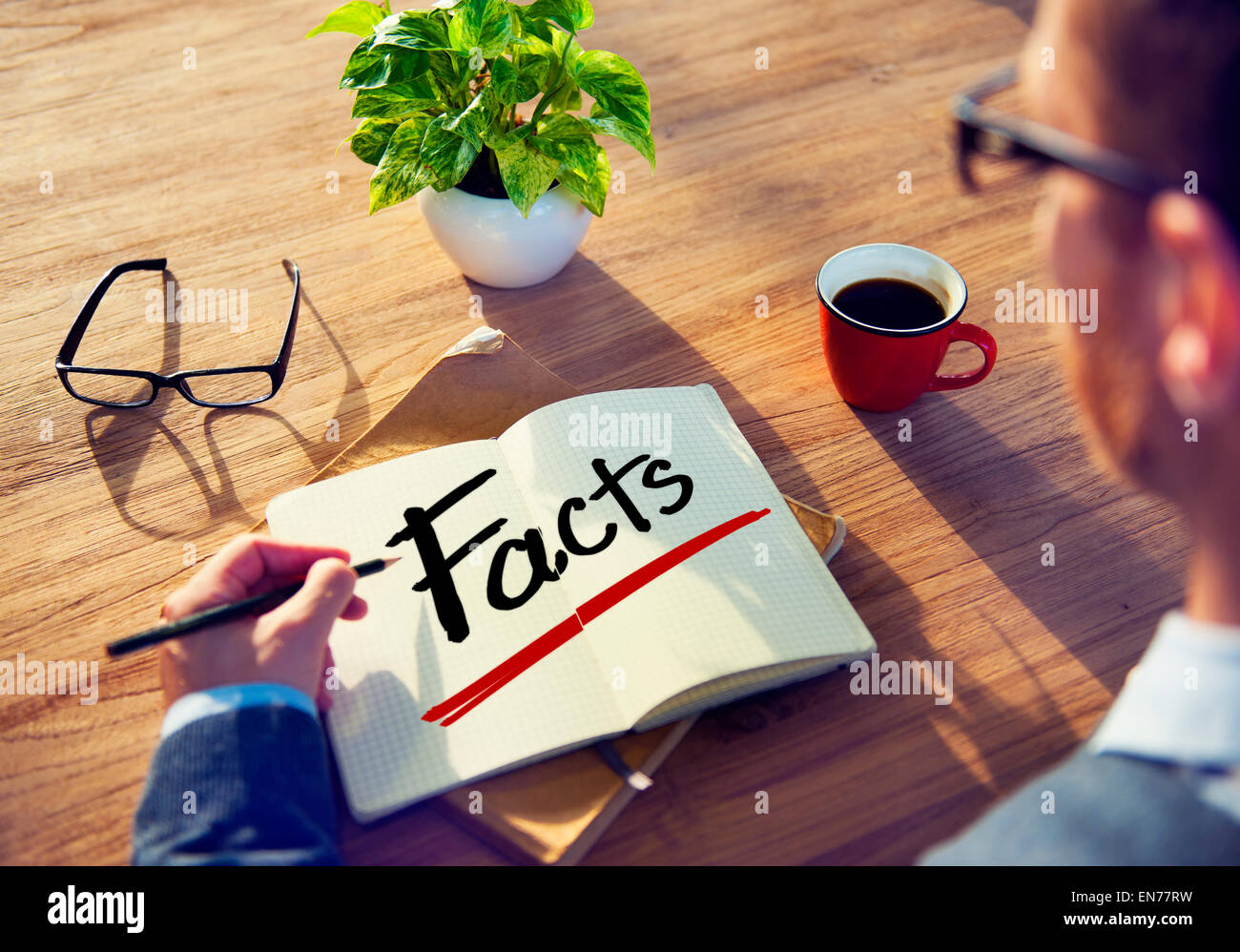 Man with a Note and Facts Concept Stock Photo - Alamy