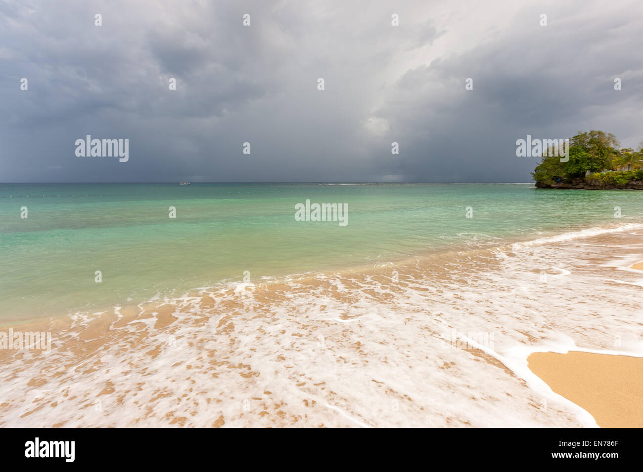Beach on tropical island. Clear blue water, sand, clouds Stock Photo ...