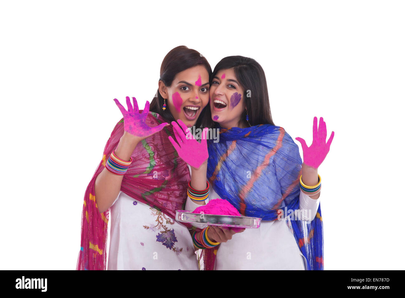 Two indian girls playing holi hi-res stock photography and images - Alamy