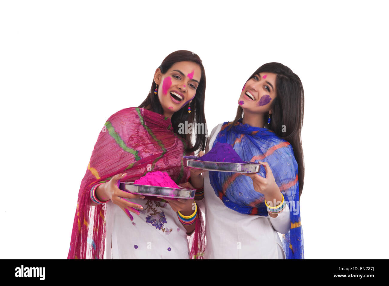 Two indian girls playing holi hi-res stock photography and images - Alamy