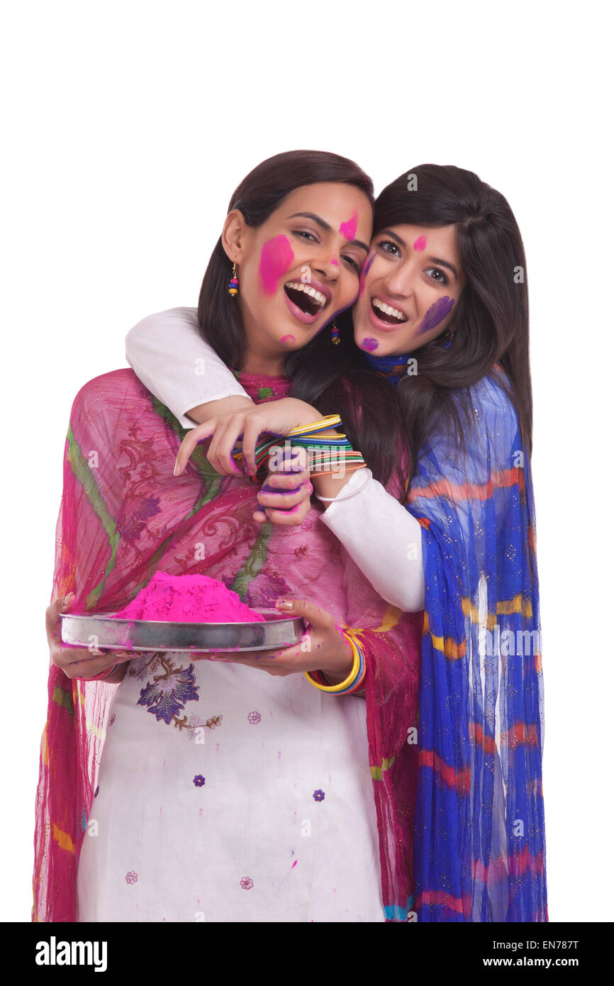 Two indian girls playing holi hi-res stock photography and images - Alamy