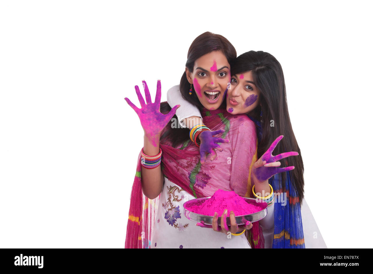 Two indian girls playing holi hi-res stock photography and images - Alamy