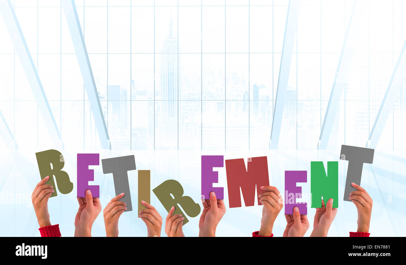 Composite image of hands holding up retirement Stock Photo - Alamy