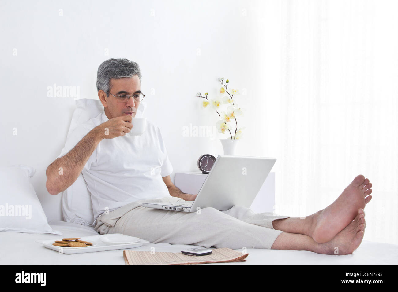 Man working on his laptop Stock Photo - Alamy