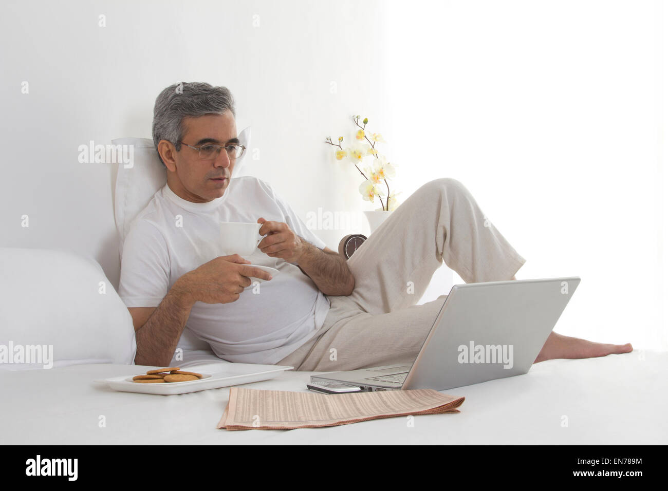 Man working on his laptop Stock Photo - Alamy