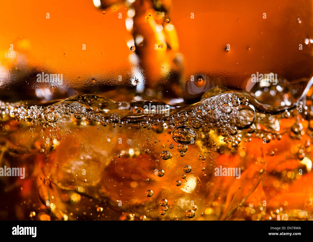 detail of an alcoholic beverage on yellow background Stock Photo - Alamy