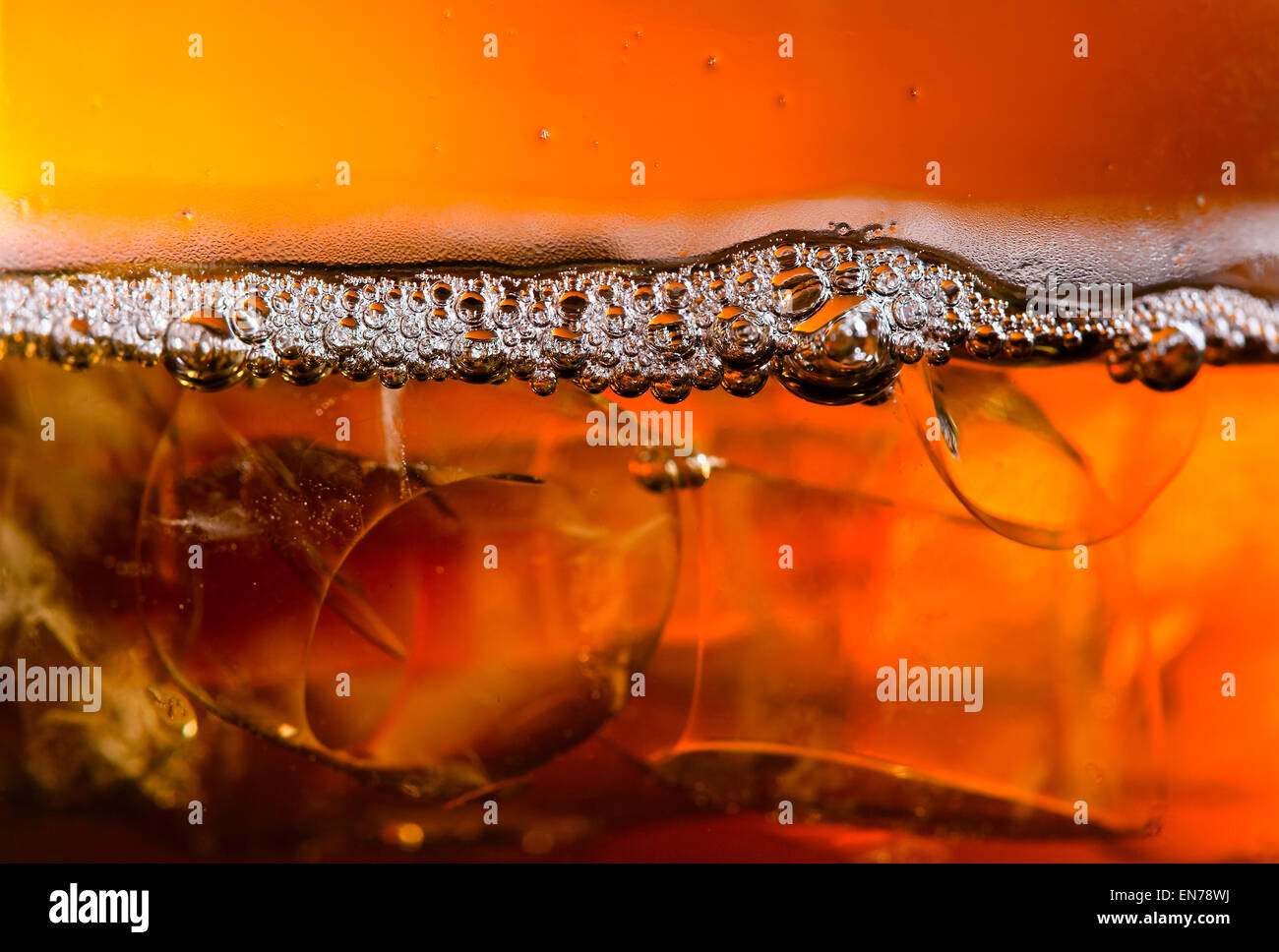 detail of an alcoholic drink on yellow background Stock Photo - Alamy
