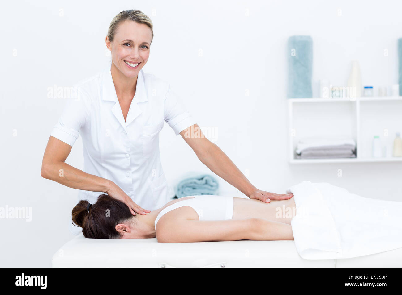 Physiotherapist doing back massage Stock Photo - Alamy