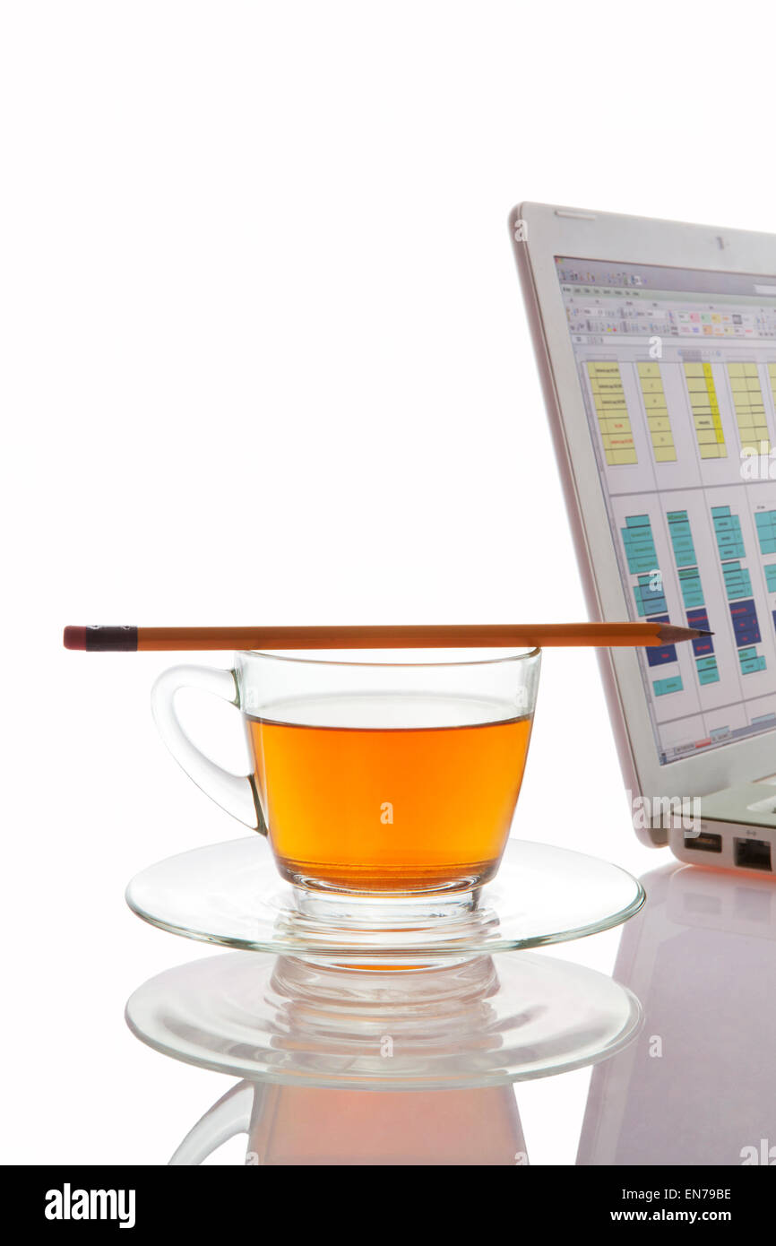 Pencil balancing on a glass cup Stock Photo - Alamy