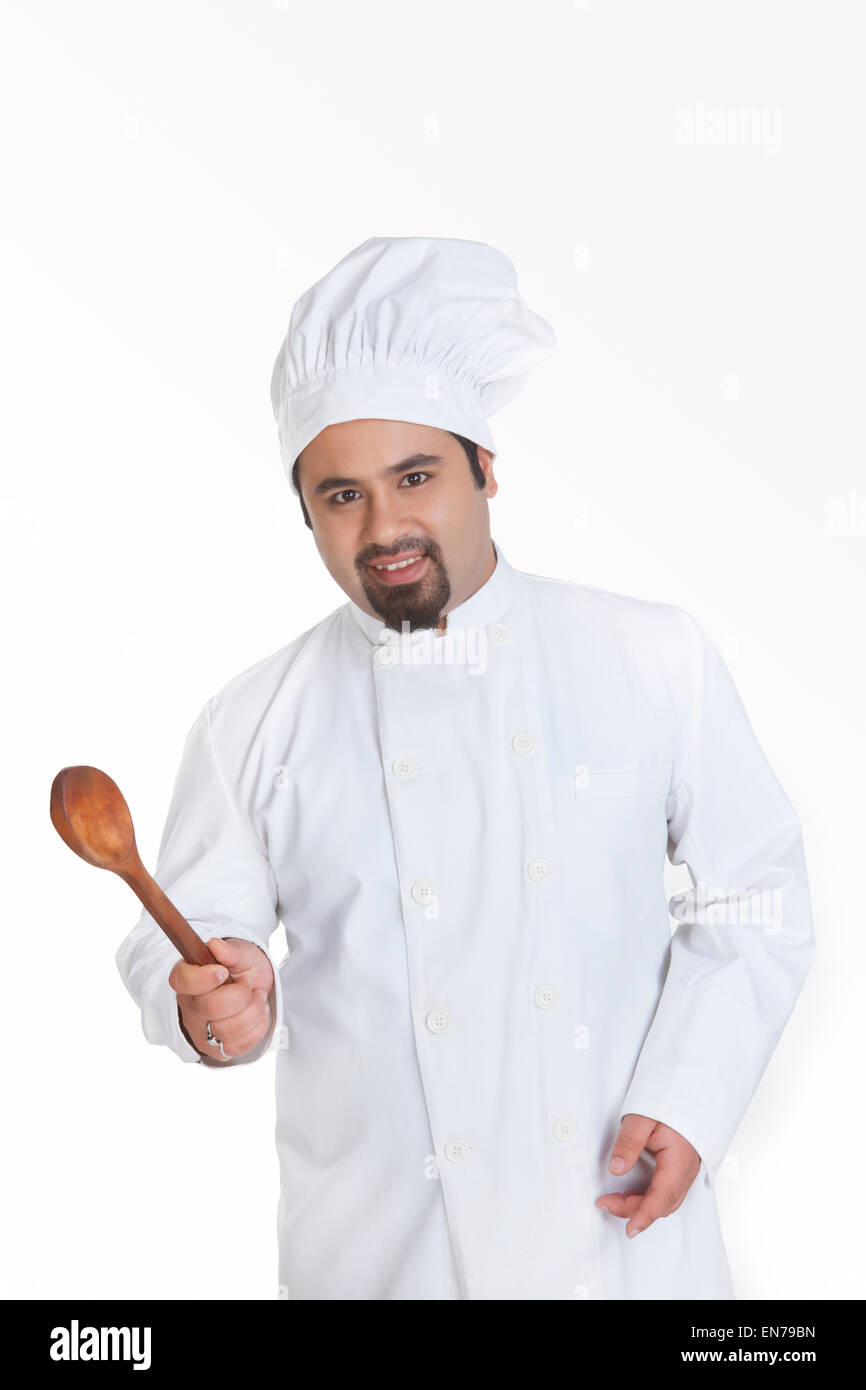 Portrait of chef with wooden spoon Stock Photo - Alamy