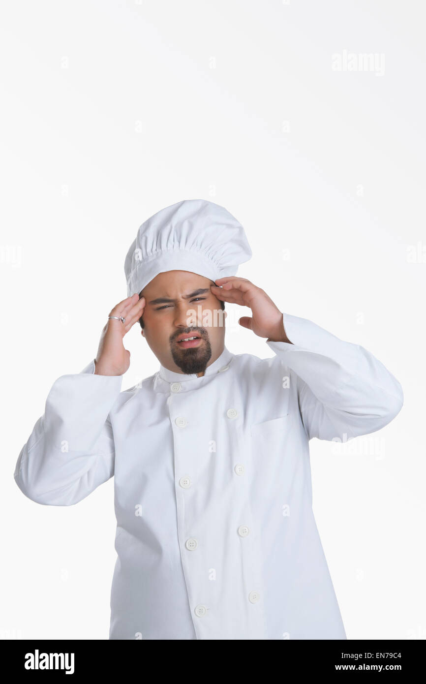 Portrait of chef with headache Stock Photo - Alamy