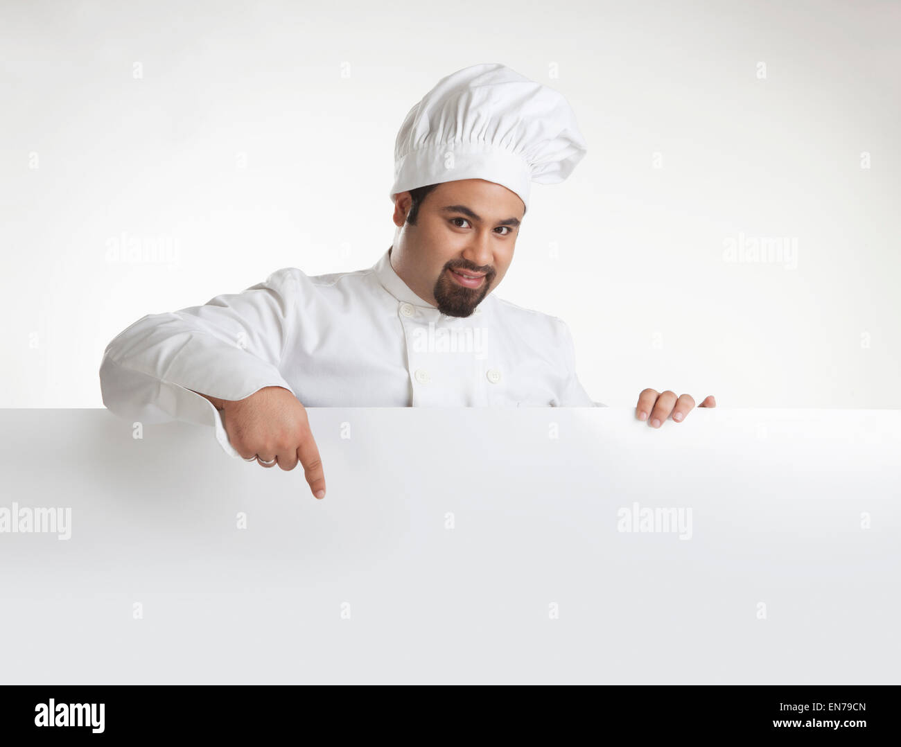 Portrait of chef pointing Stock Photo - Alamy