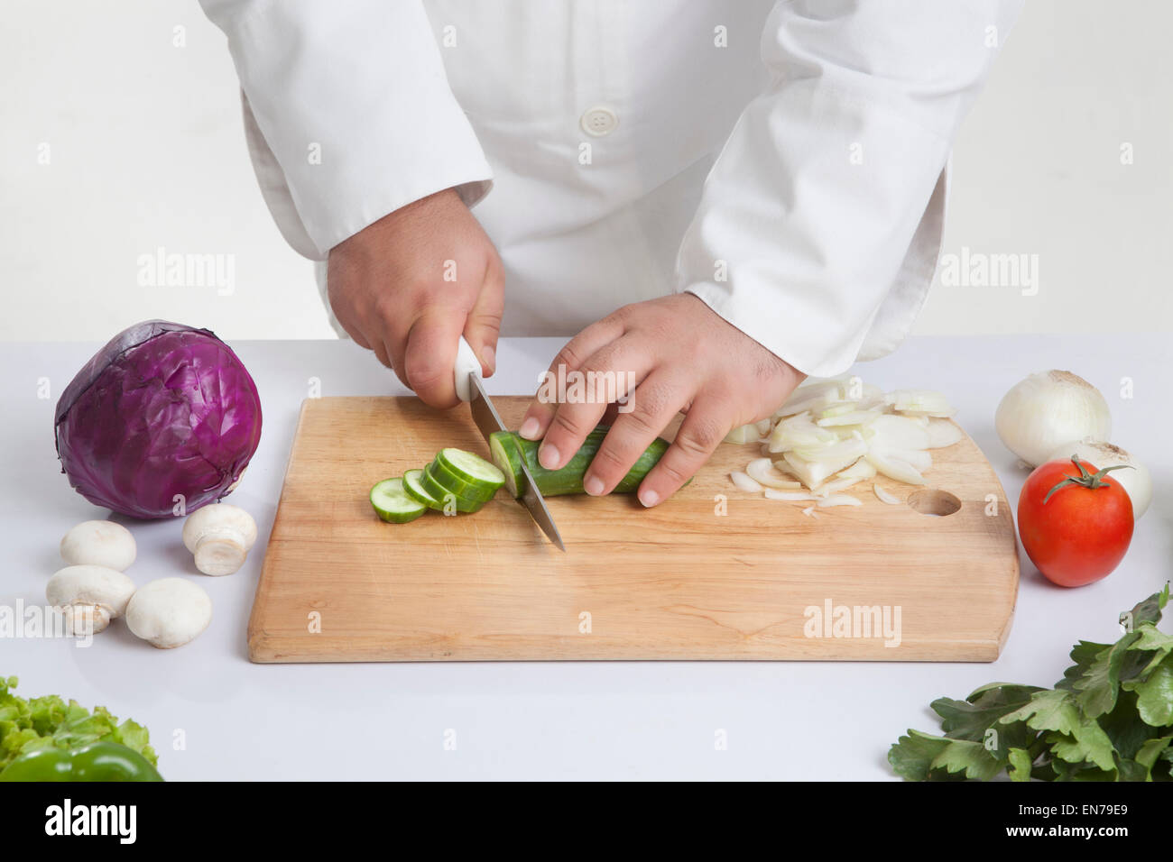 Professional chef cutting tomato hi-res stock photography and images ...